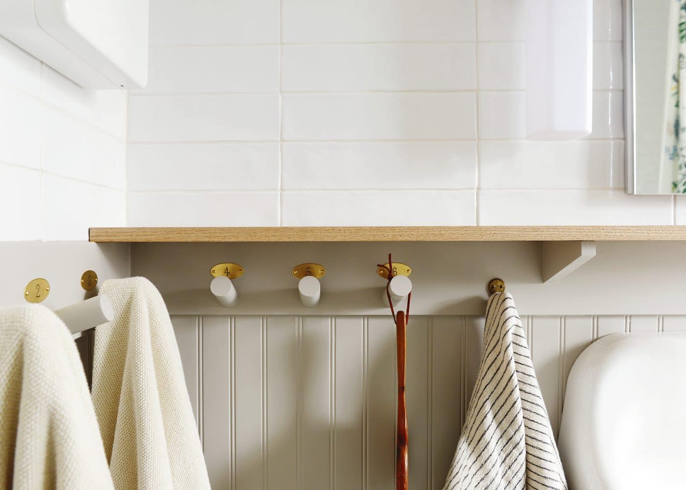 Our DIY Beadboard Wall Treatment with Hooks + Countertop - Yellow Brick ...